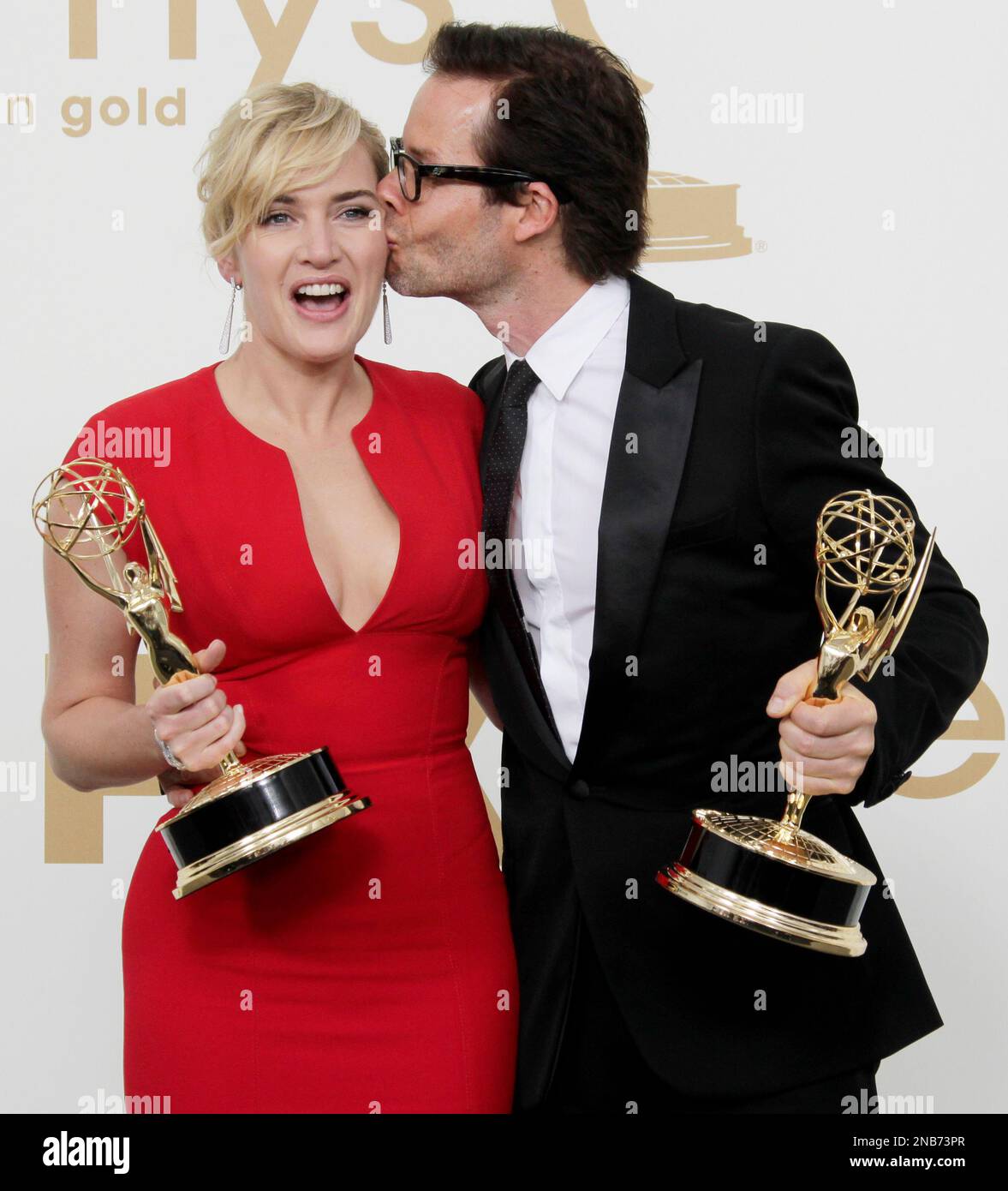 ""Mildred Pierce" cast members Kate Winslet, left and Guy Pearce hold ...