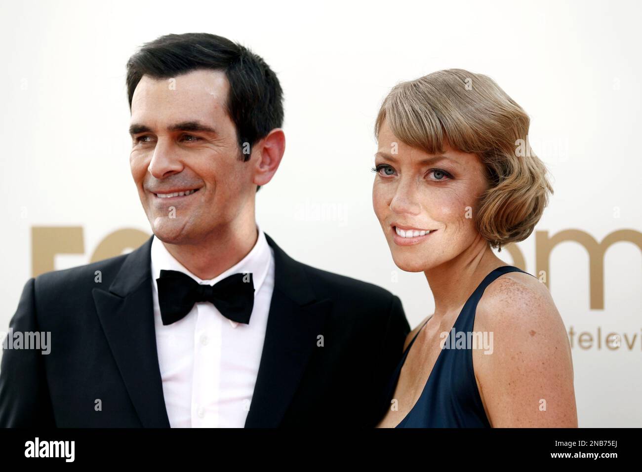 Ty Burrell, left, and his wife Holly arrive at the 63rd Primetime Emmy ...