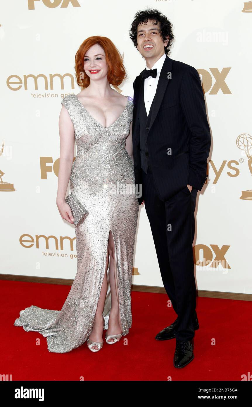 Christina Hendricks, left, and Geoffrey Arend arrive at the 63rd ...