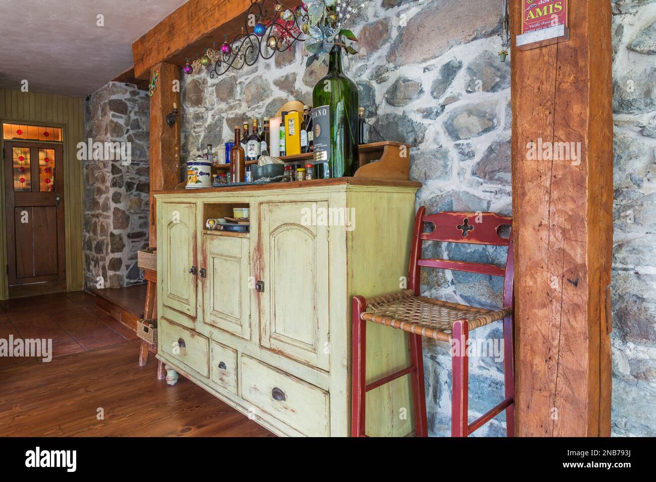 Antique distressed yellow wooden buffet and red stained wood and woven ...