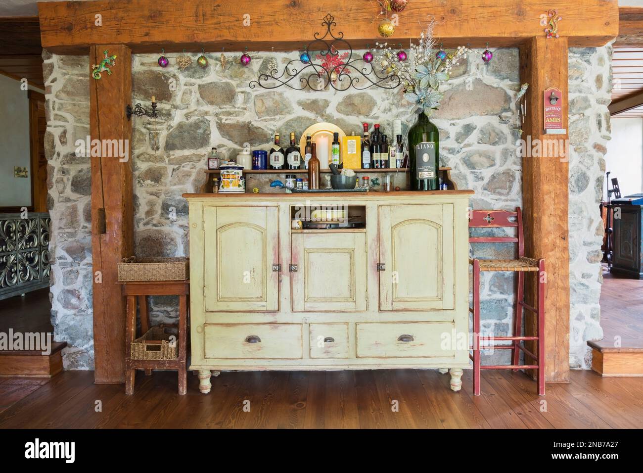 Antique distressed yellow wooden buffet and red stained wood and woven ...