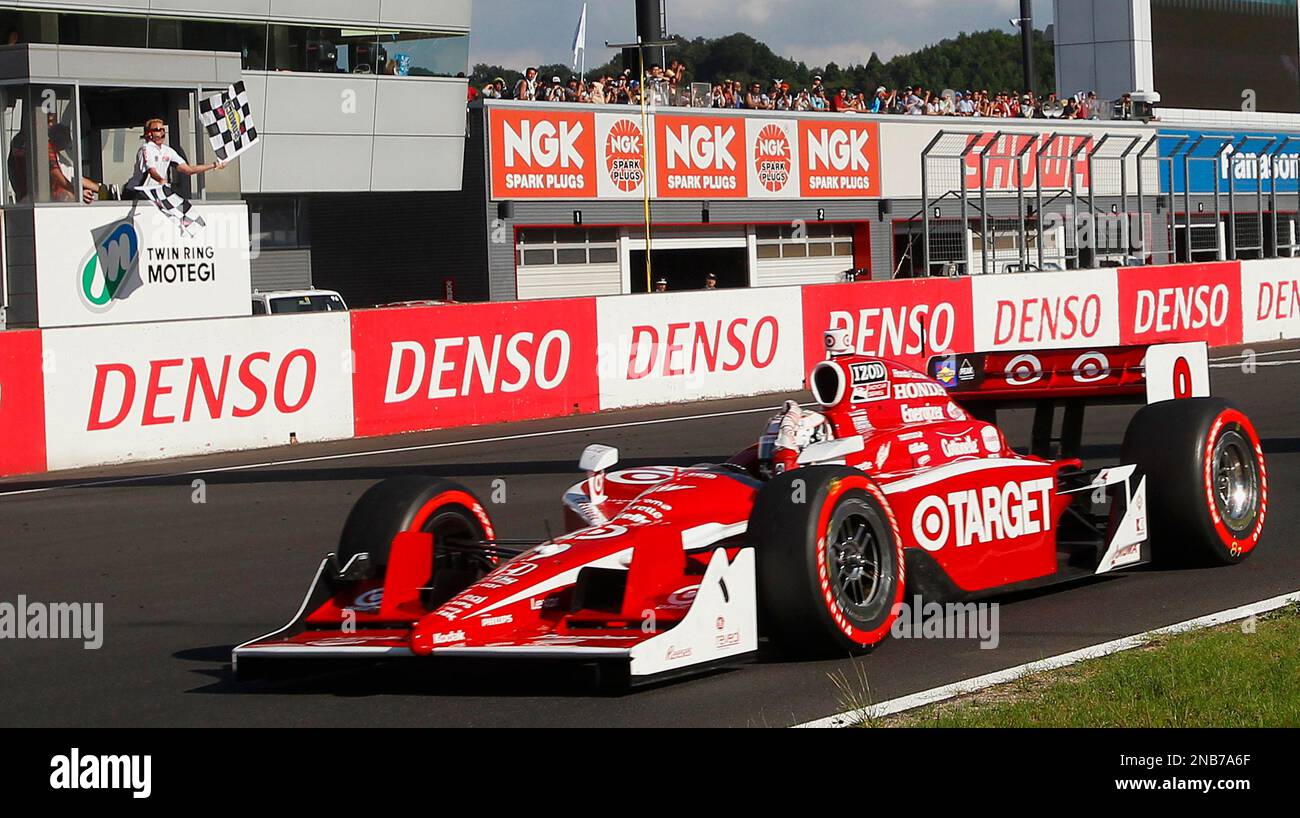 IndyCar driver Scott Dixon of New Zealand crosses the finish line to ...