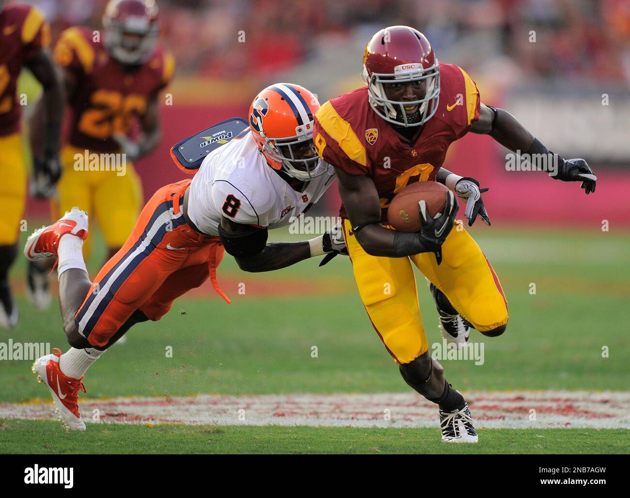 Southern California wide receiver Marqise Lee, right, is tackled by ...