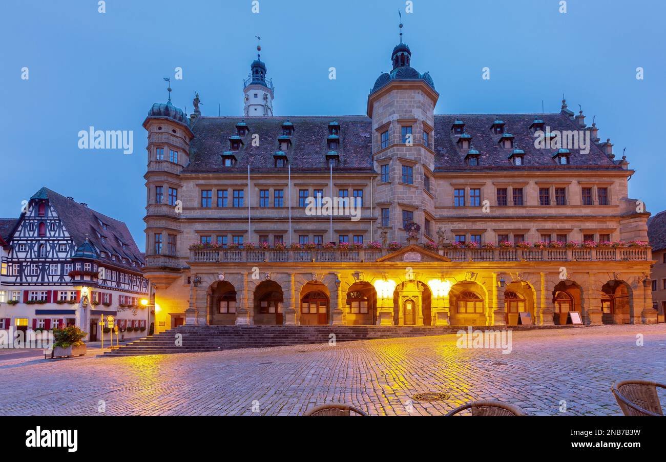 Old traditional medieval street in night illumination. Rothenburg ob ...