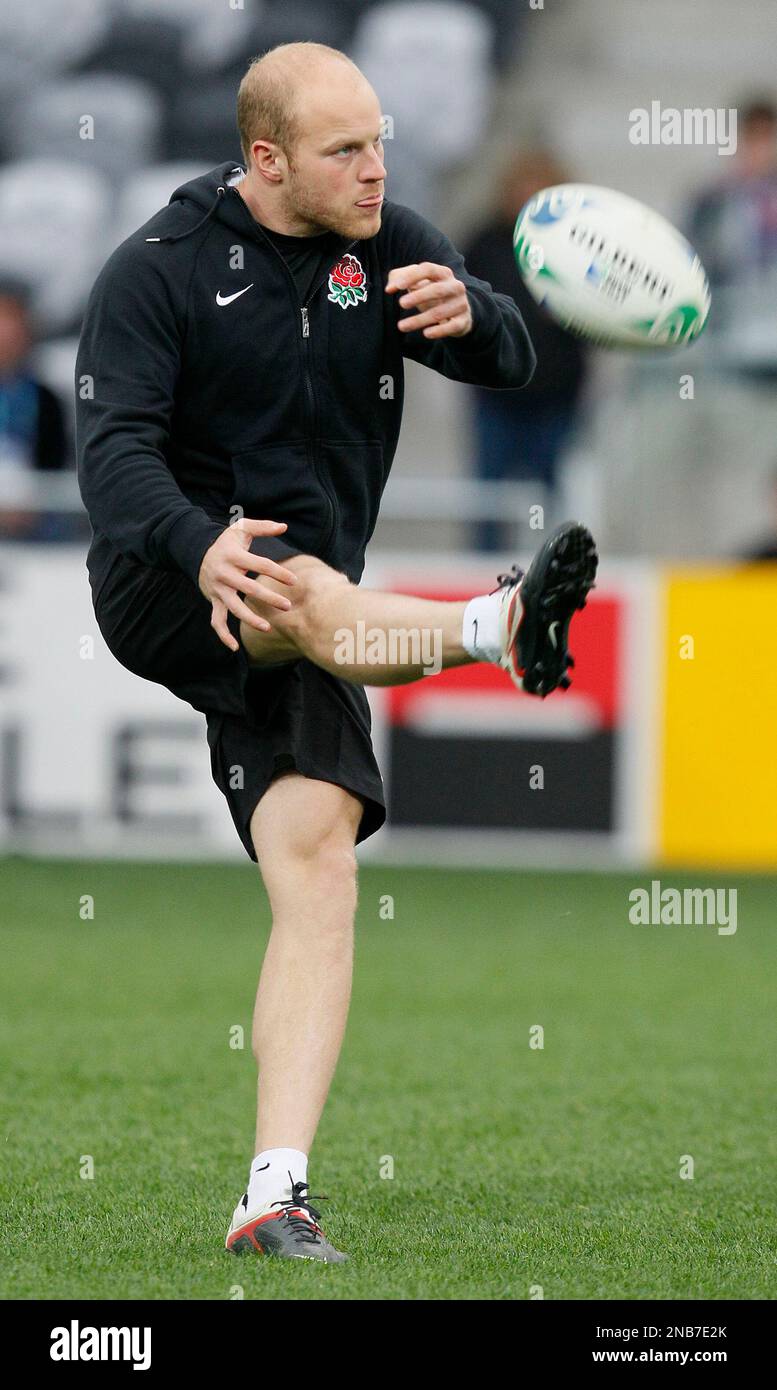 England rugby team player Joe Simpson kicks a ball during a training ...