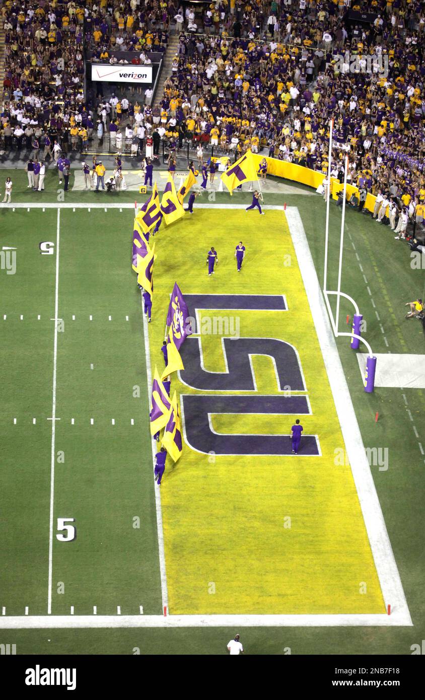 LSU cheerleaders run through the endzone at LSU Tiger Stadium during ...