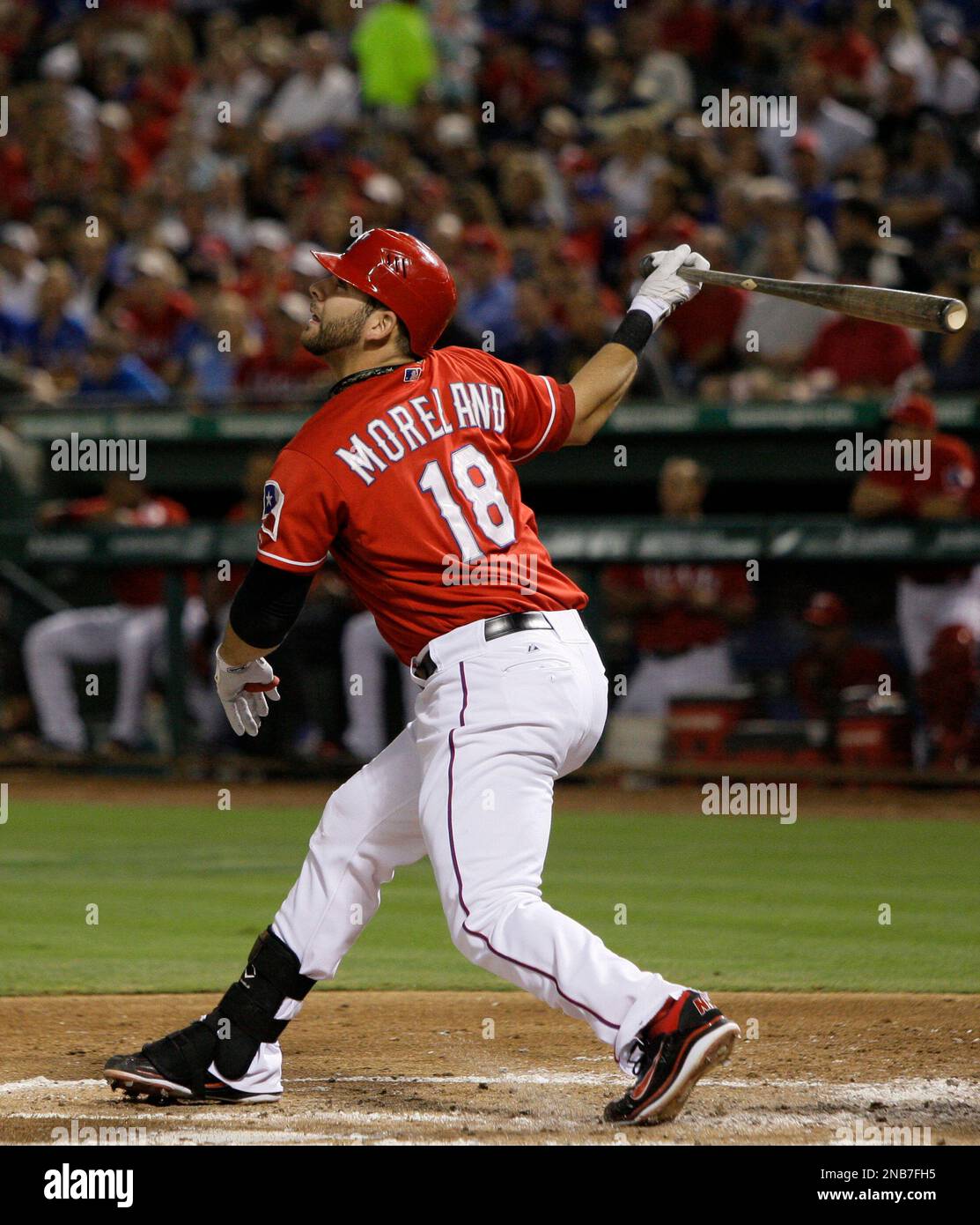 Texas Rangers' Mitch Moreland (18) follows through on a swing against ...