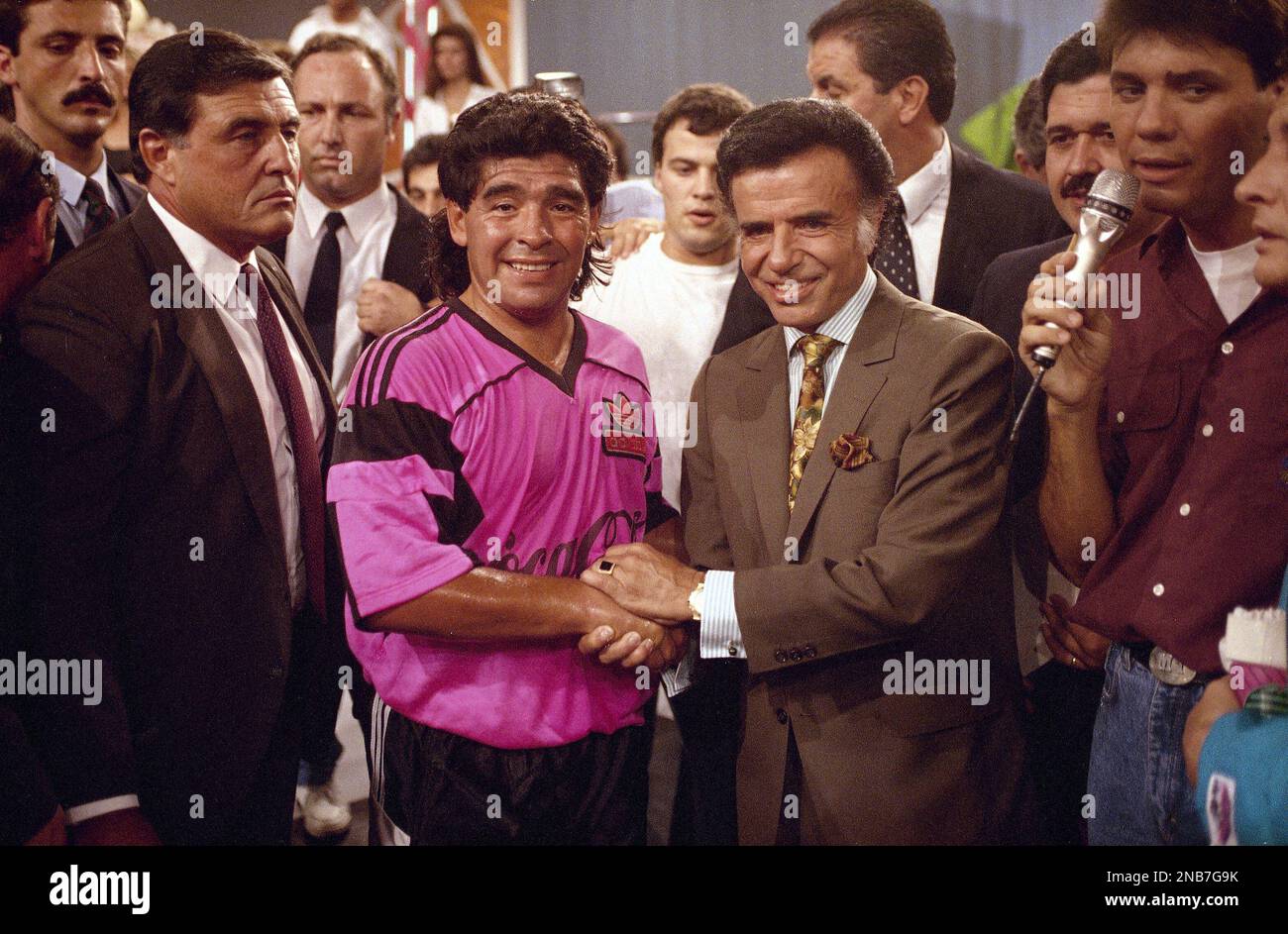 Argentina's President Carlos Menem, right, shakes hands with Argentina ...