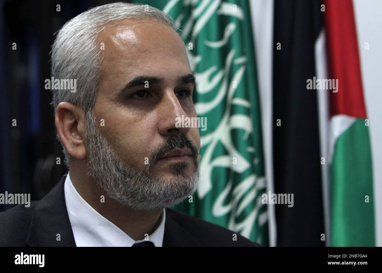 Palestinian Hamas spokesperson Fawzi Barhoum watches Palestinian ...