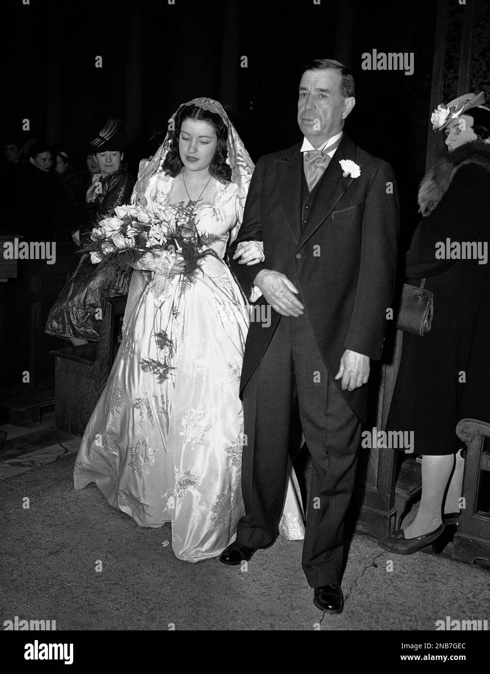 Sen. Dennis Chavez (D-N.M.), right, escorts his daughter Gloria to the ...