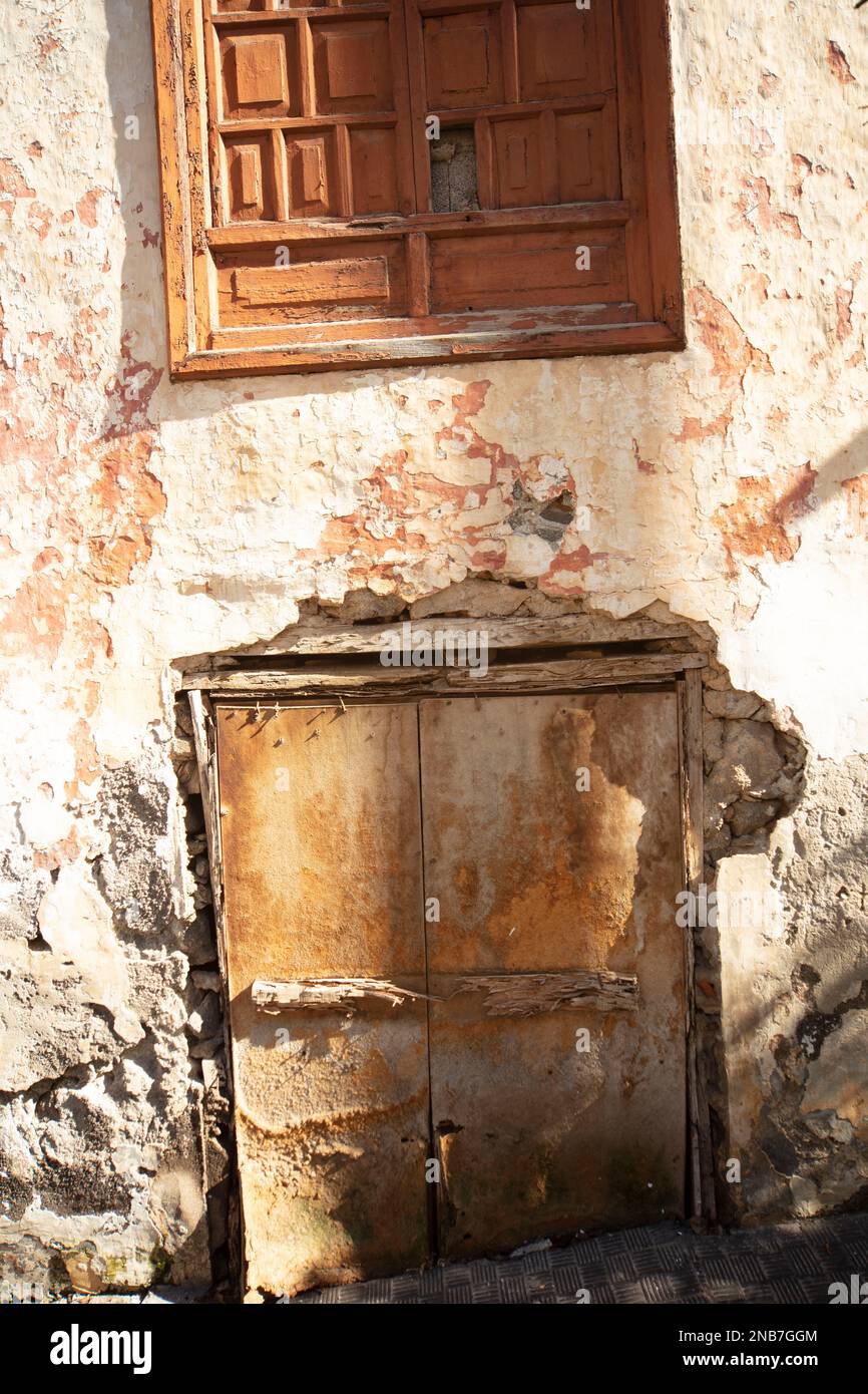 Side lit architectural textures of exterior peeling building exterior ...