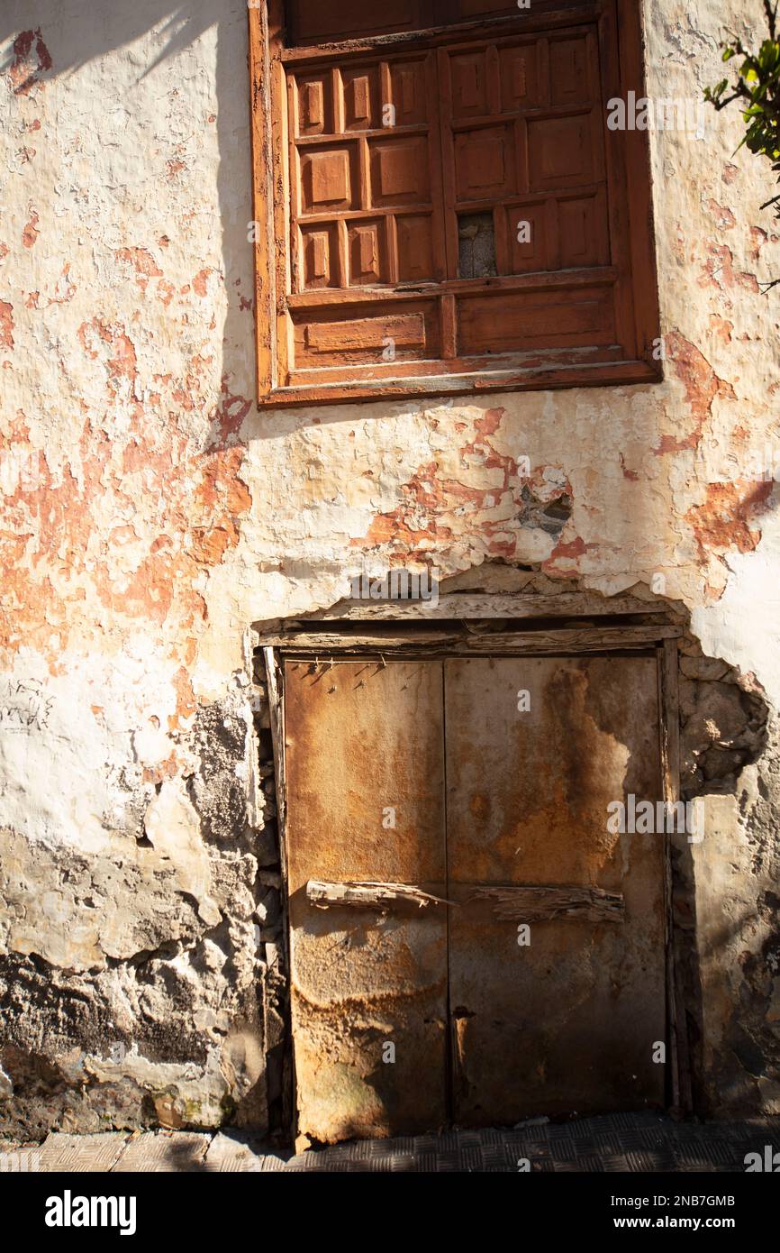 Side lit architectural textures of exterior peeling building exterior ...