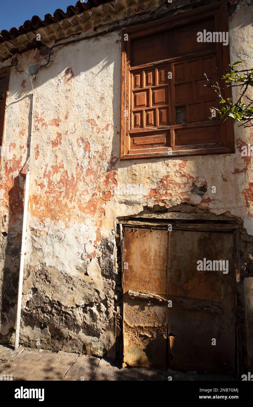 Side lit architectural textures of exterior peeling building exterior ...