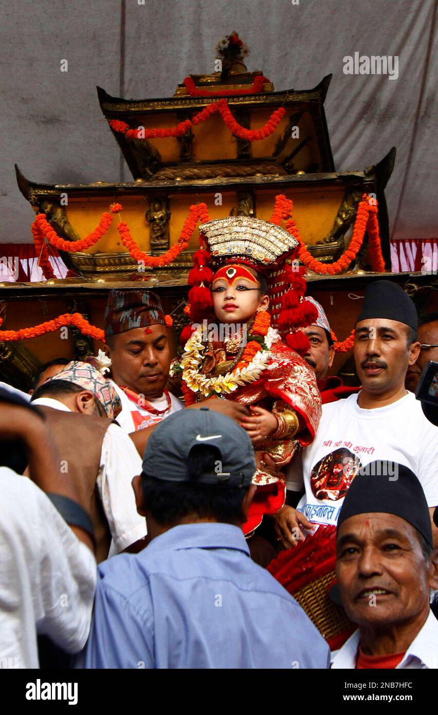 Devotees carry Nepal's living goddess, locally known as Kumari, for a ...