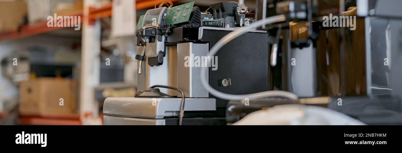Warehouse with broken coffee machines ready to repair Stock Photo - Alamy