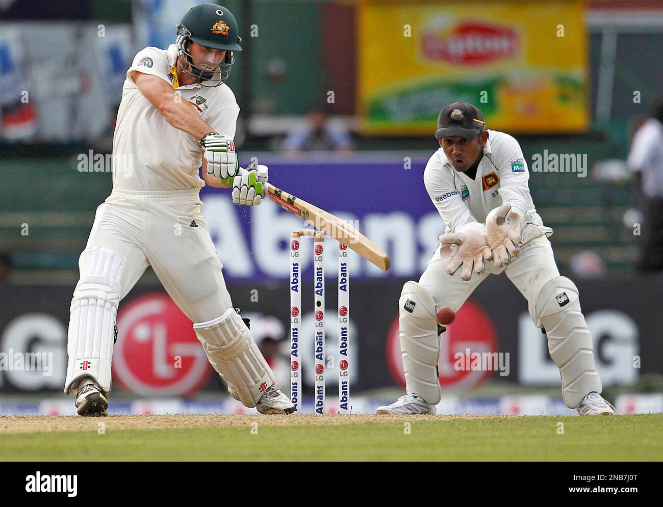 Australian cricketer Shaun Marsh, left, bats in front of Sri Lankan ...