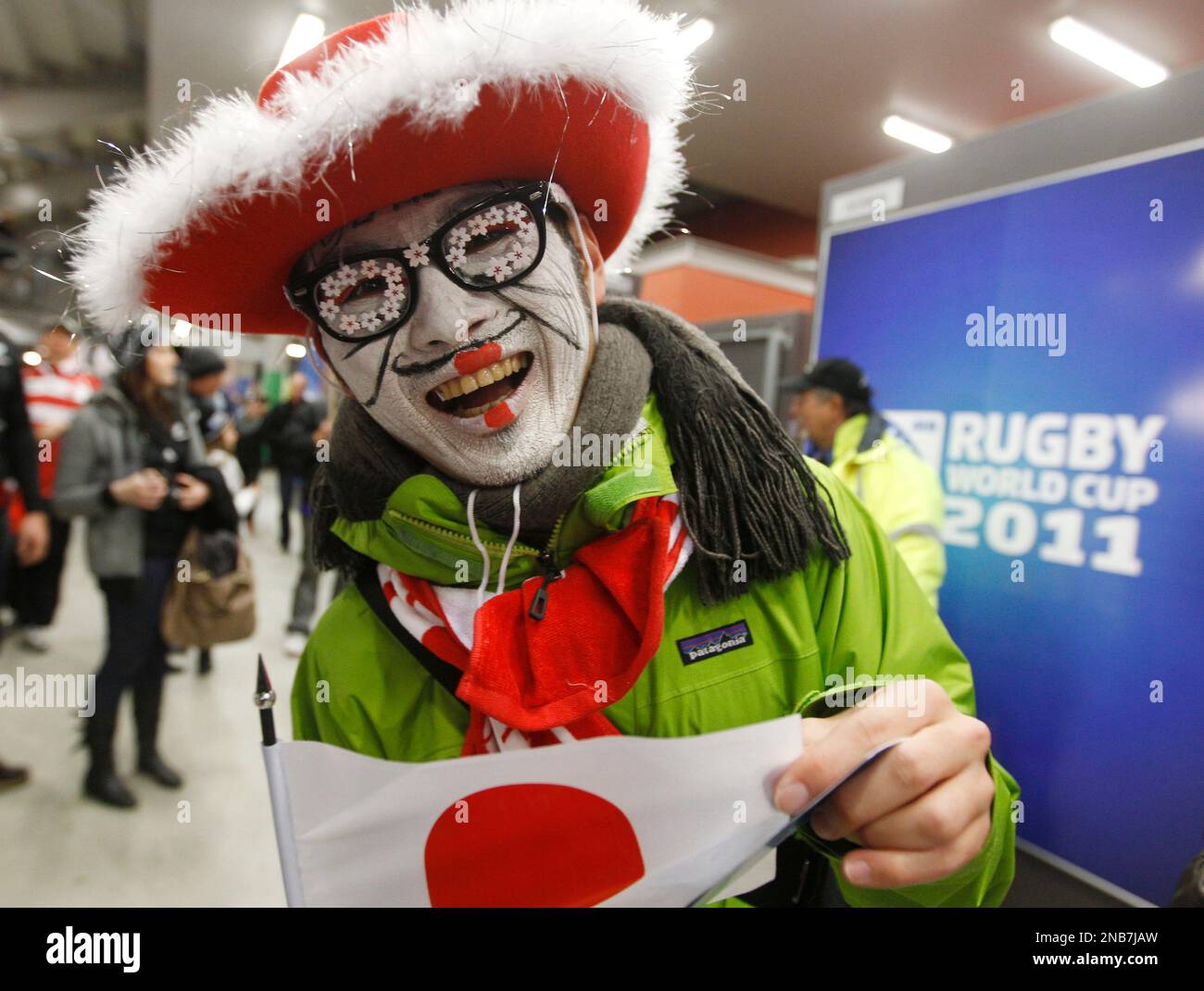 A Japanese fan waits for the start of her team's Rugby World Cup Pool A ...