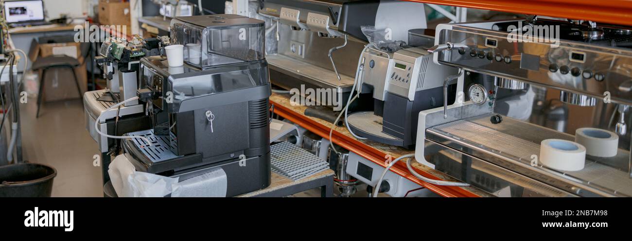 Warehouse with coffee machines ready to work Stock Photo - Alamy