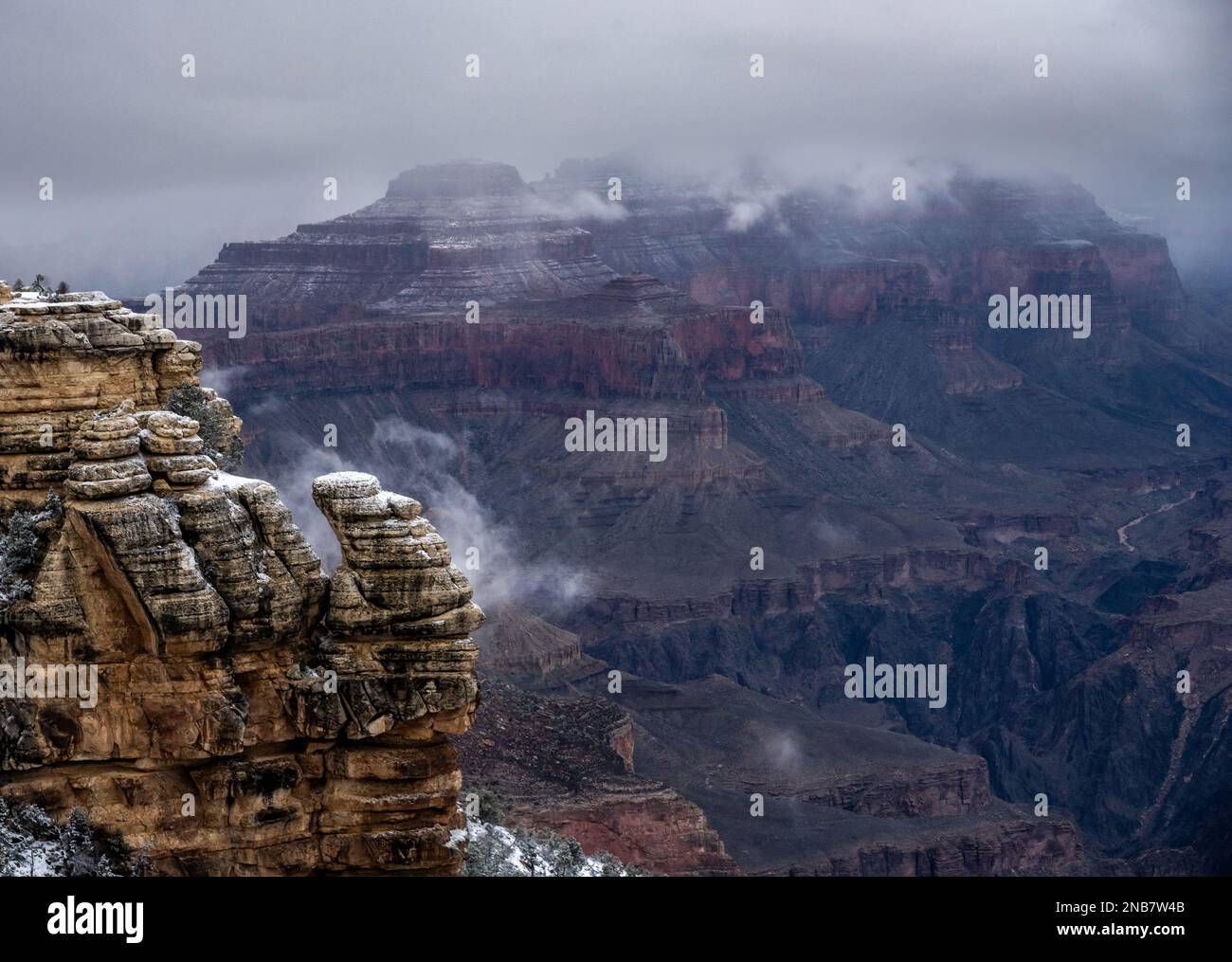 Snow Covers The Top of Grand Canyon as Clouds Float By on winter day ...