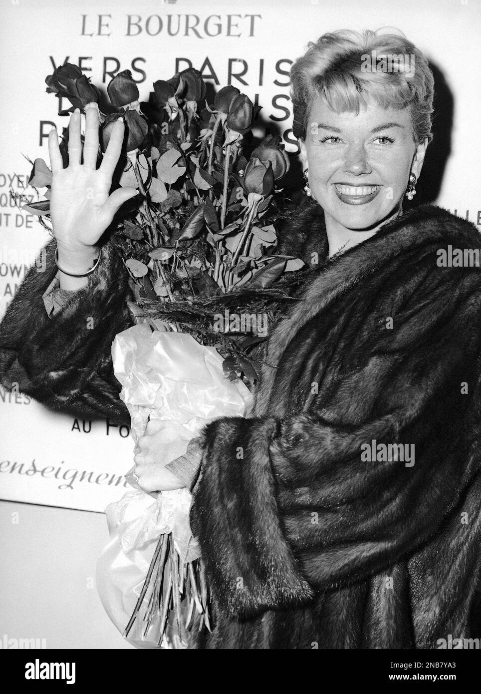 American actress and singer Doris Day holds a bouquet of roses at Le ...