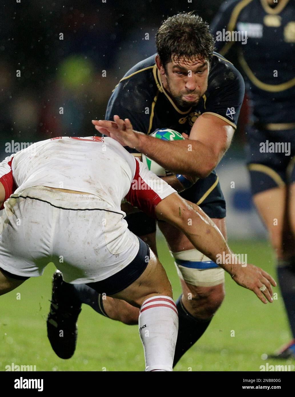 Scotland's Jim Hamilton, right, is tackled by Georgia's Davit Kacharava ...
