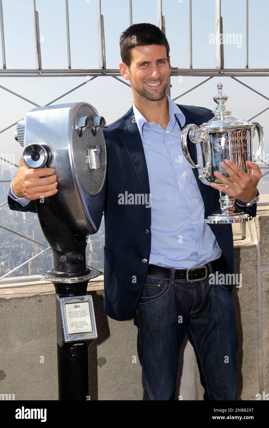 Novak Djokovic, of Serbia, smiles at the top of the Empire State ...