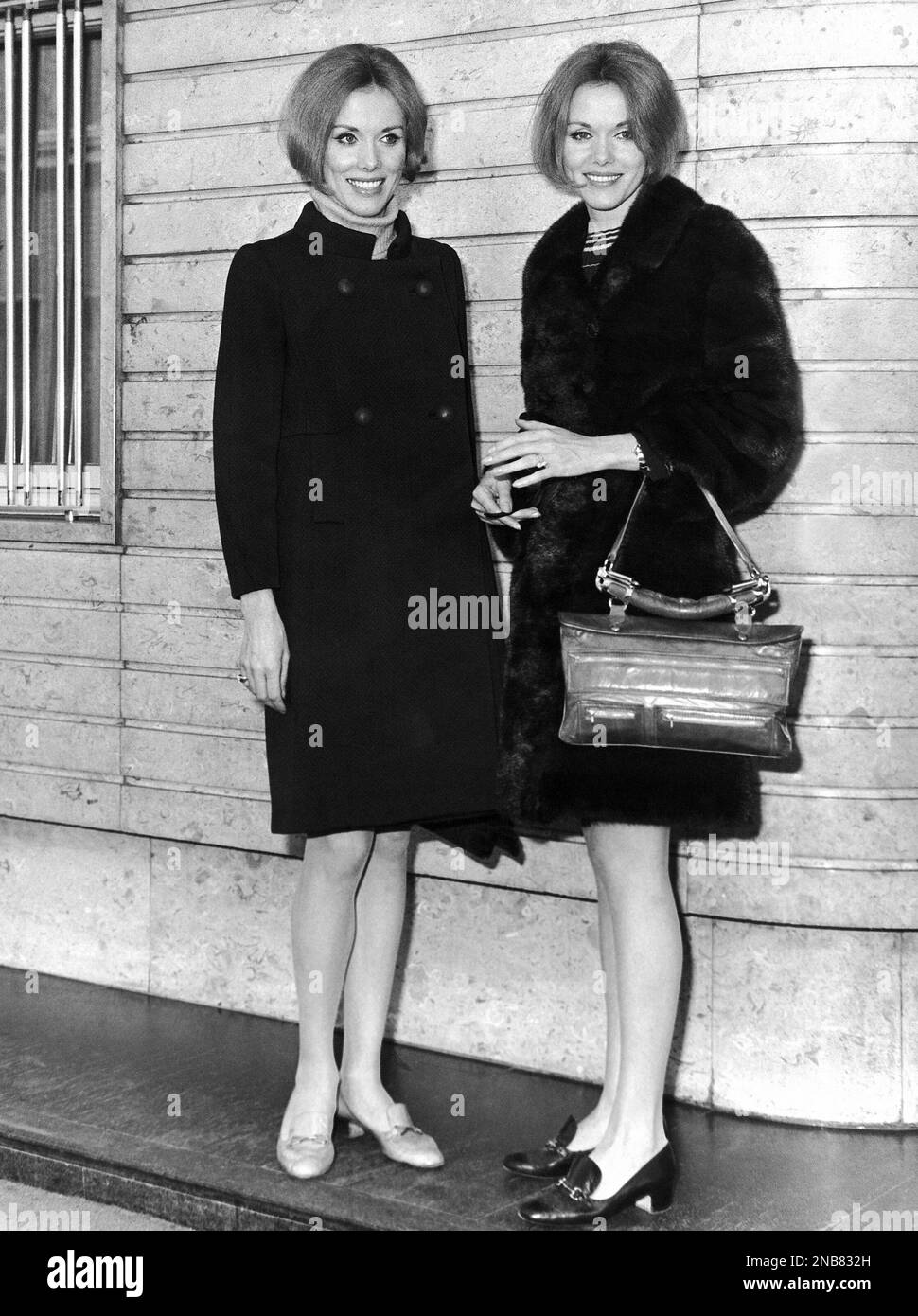 The German twin dancers, Alice and Ellen Kessler pose in front of the ...