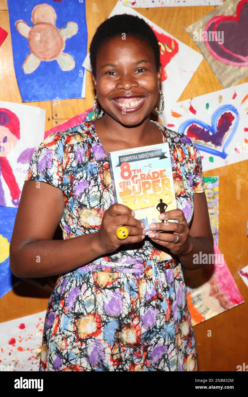 Author Olugbemisola Rhuday-Perkovich poses with her book at the NY ...