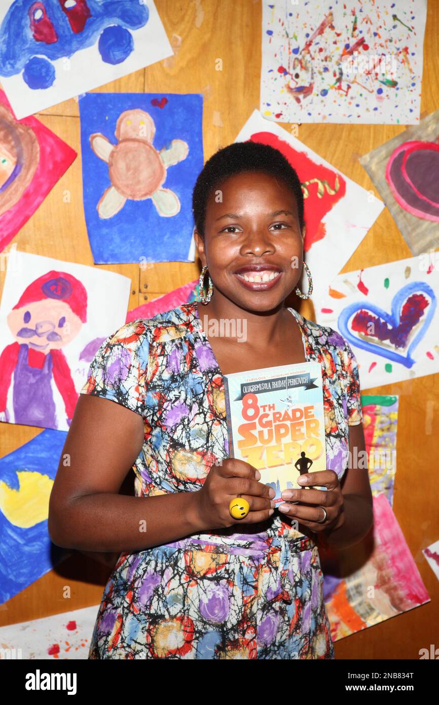 Author Olugbemisola Rhuday-Perkovich poses with her book at the NY ...