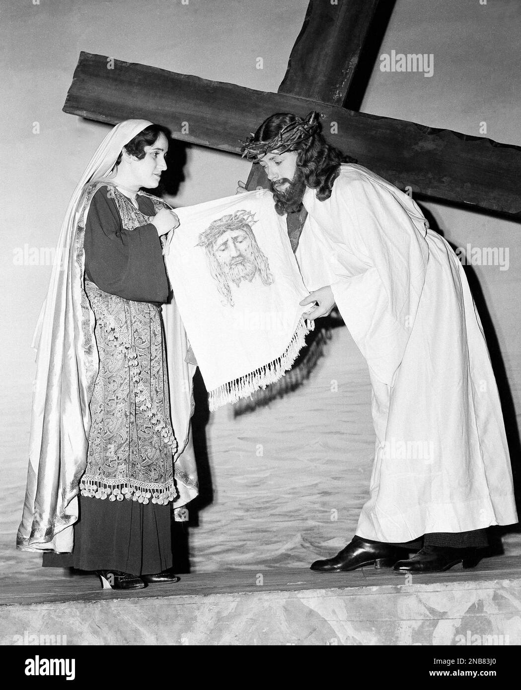 Veronica wipes the face of Christ with a veil during the passion play ...