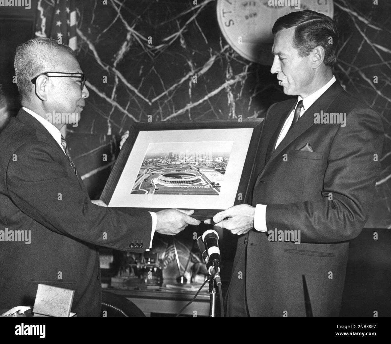 Georgia Gov. Carl E. Sanders, right, presents a picture of Atlanta ...