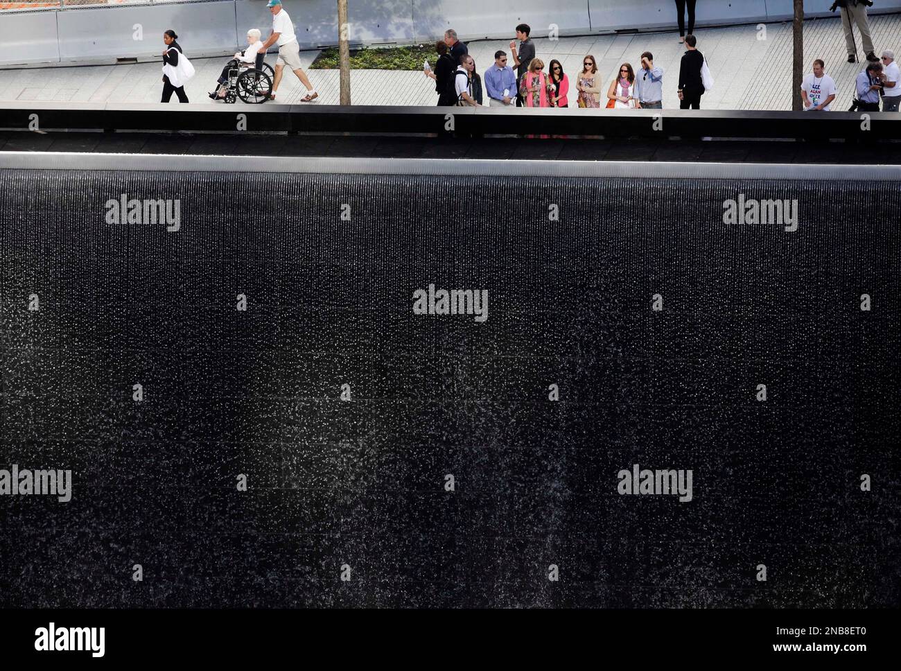 Family members visit a September 11 Memorial waterfall during the ...