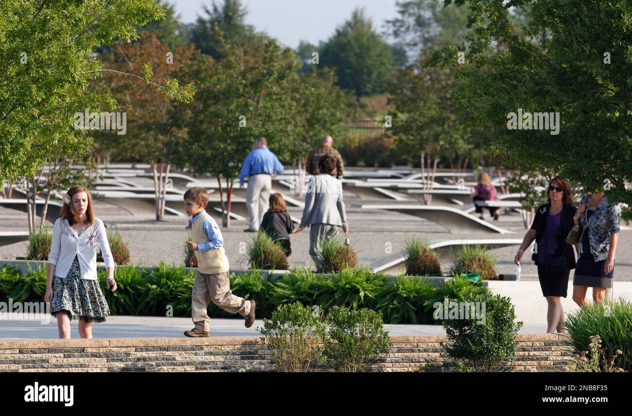 Family members visit the Pentagon Memorial before ceremonies for the ...