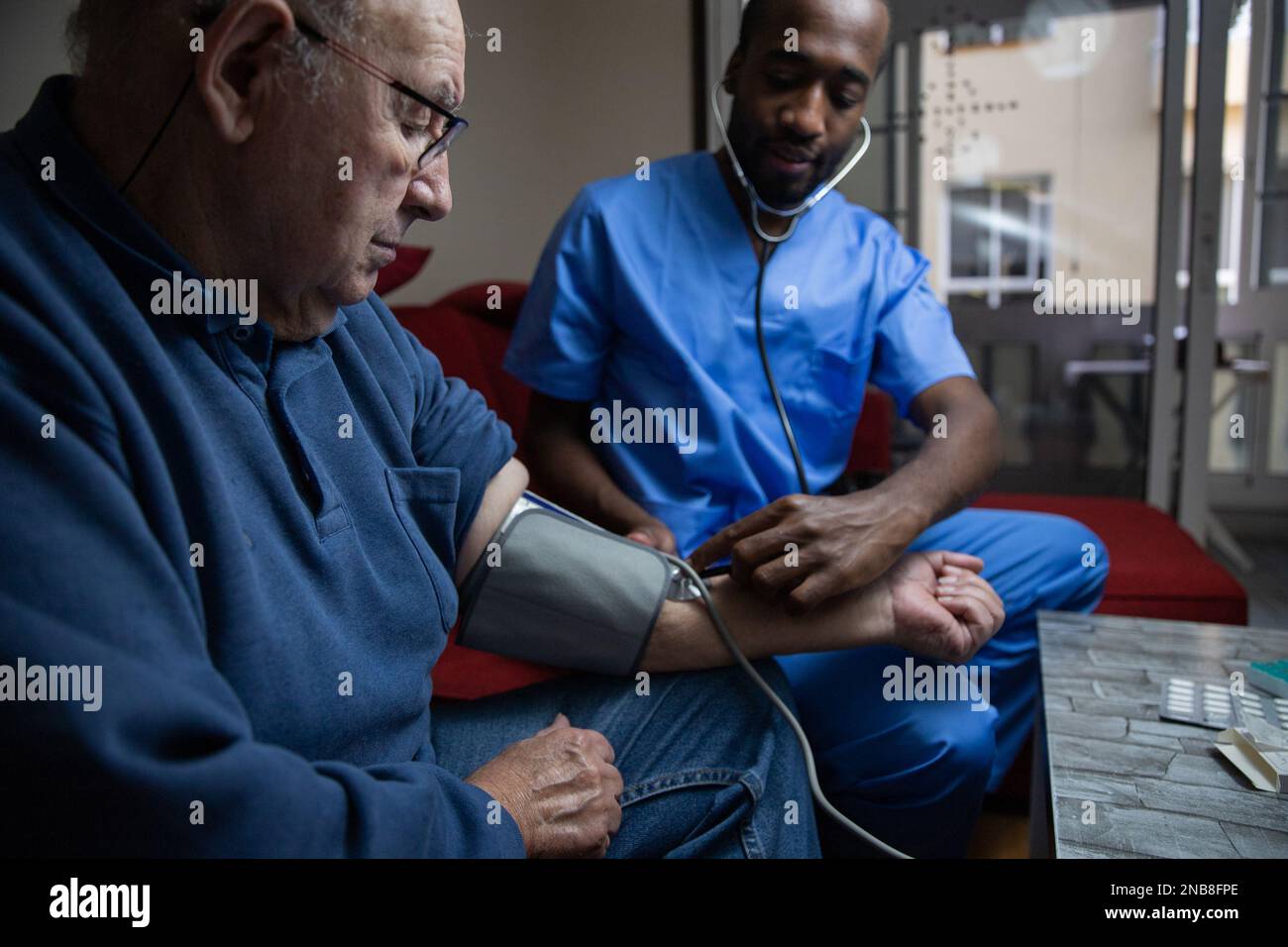Elderly man checking blood hi-res stock photography and images - Alamy