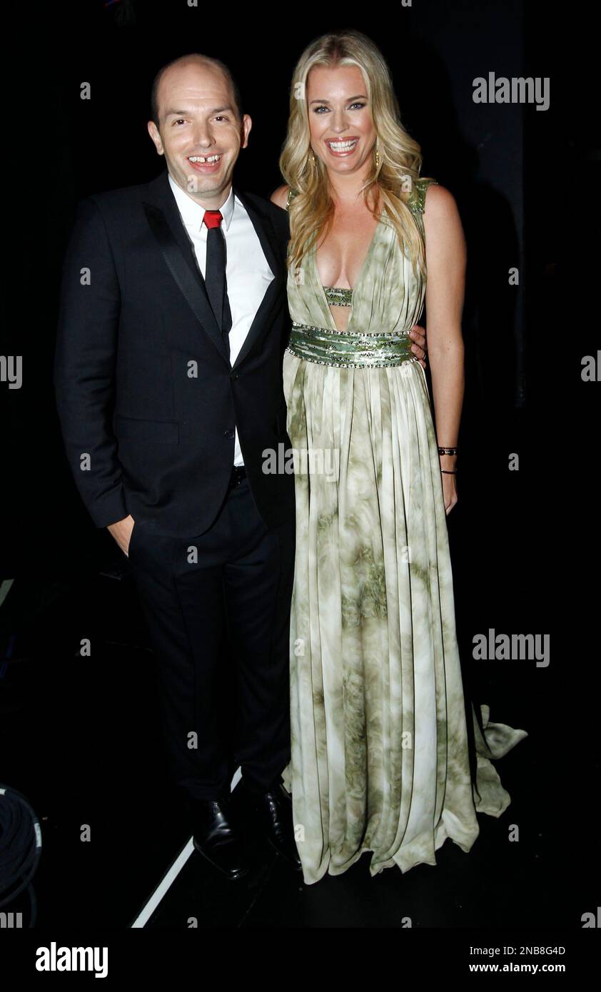 Paul Scheer, left, and and Rebecca Romijn are seen backstage at the ...