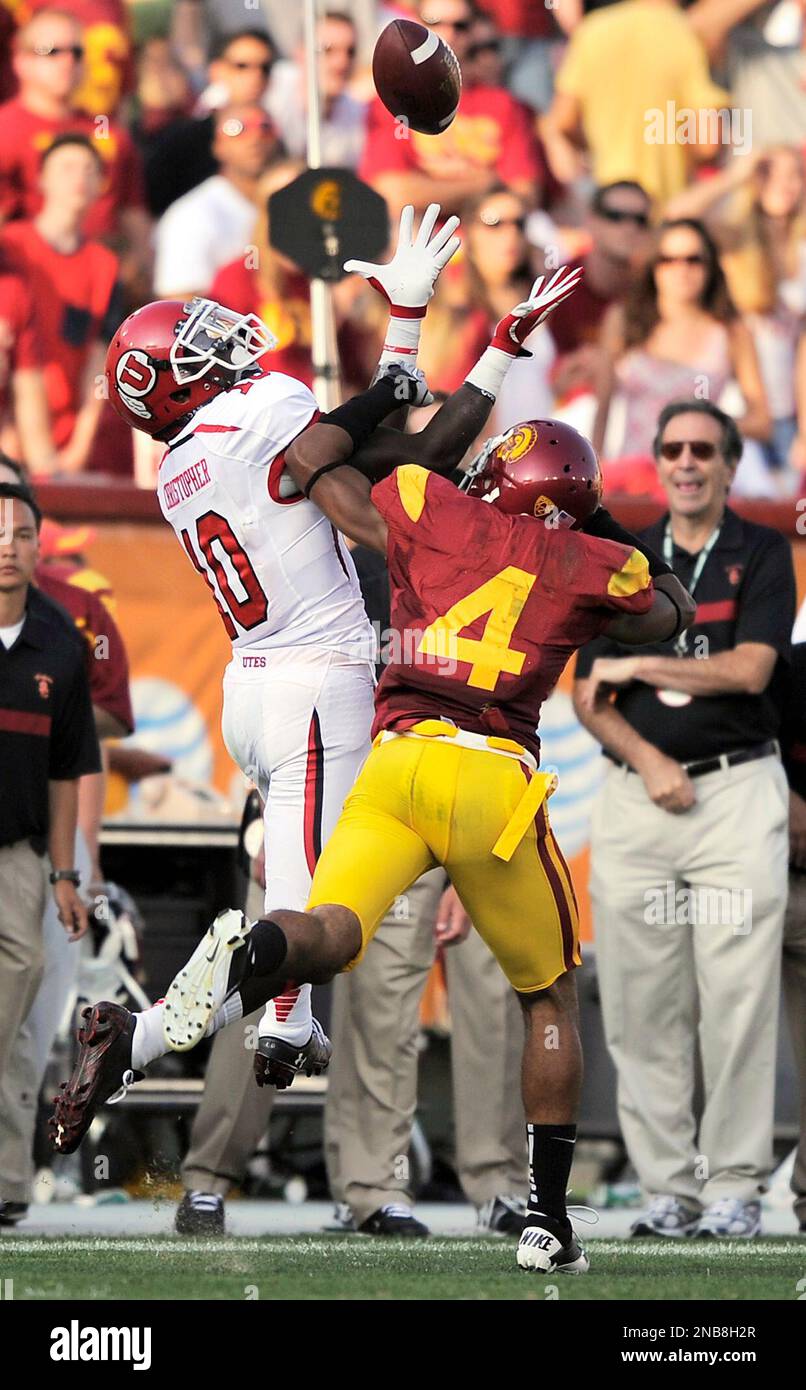 Utah wide receiver DeVonte Christopher, left, catches a pass as ...