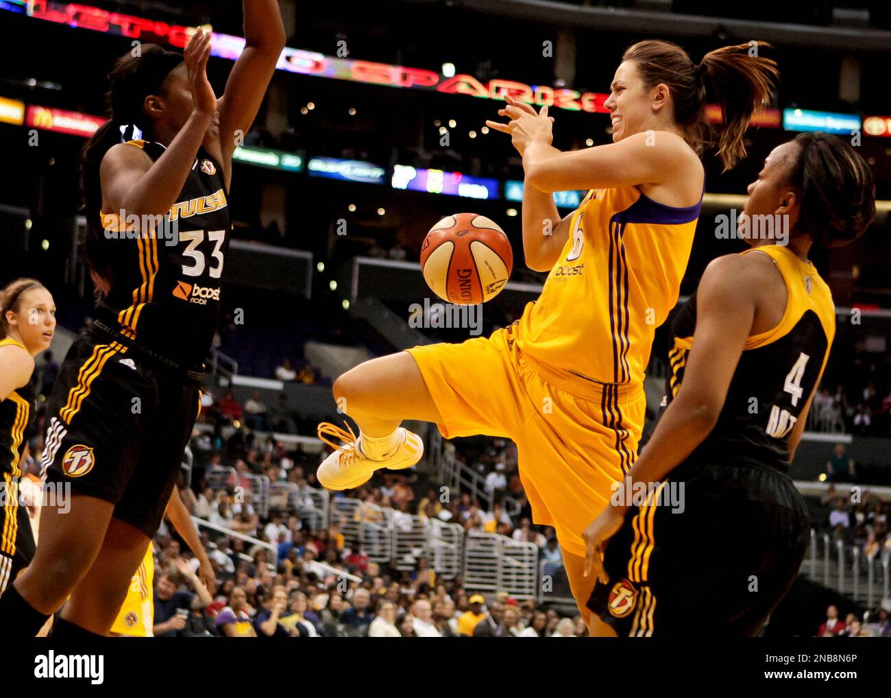 Los Angeles Sparks forward Jenna O'Hea, middle, is fouled by Tulsa ...