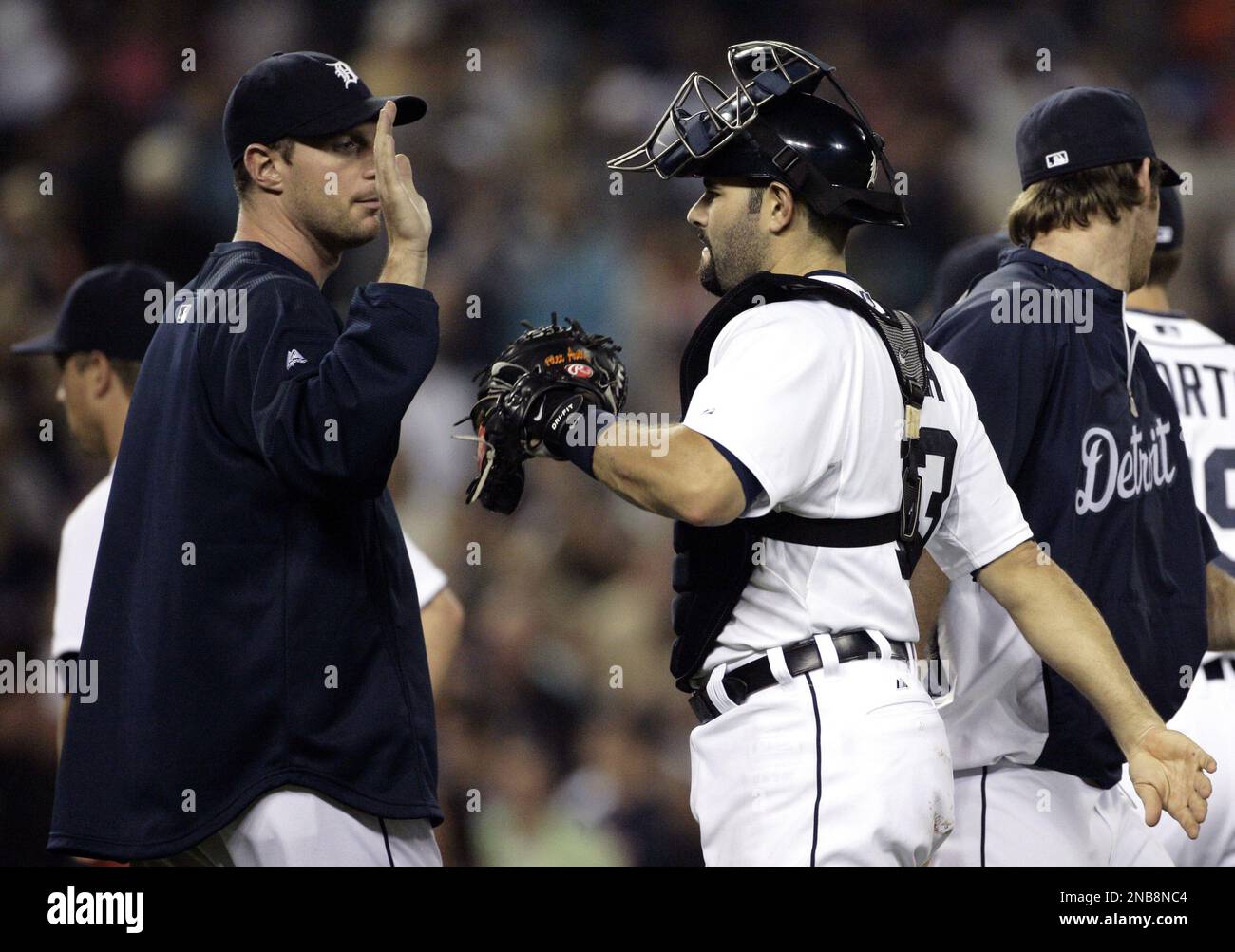 Detroit Tigers catcher Alex Avila, right, is congratulated by pitcher ...