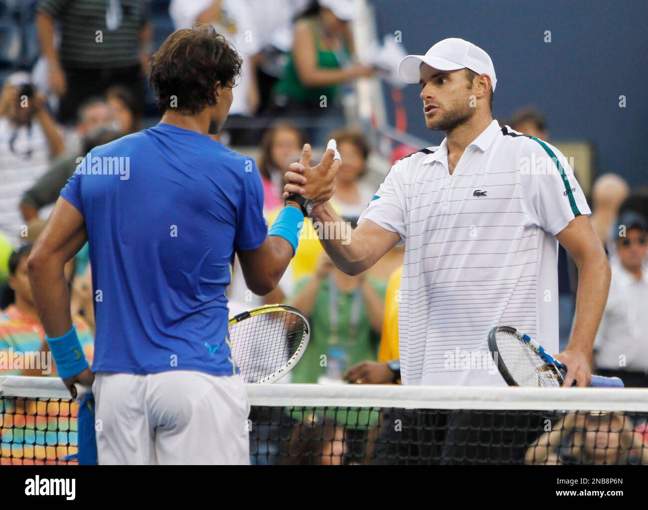 Andy Roddick, right, shakes hands with Rafael Nadal of Spain after ...