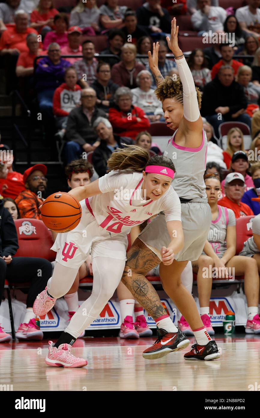 Indiana's Sara Scalia, left, dribbles around Ohio State's Rikki Harris ...