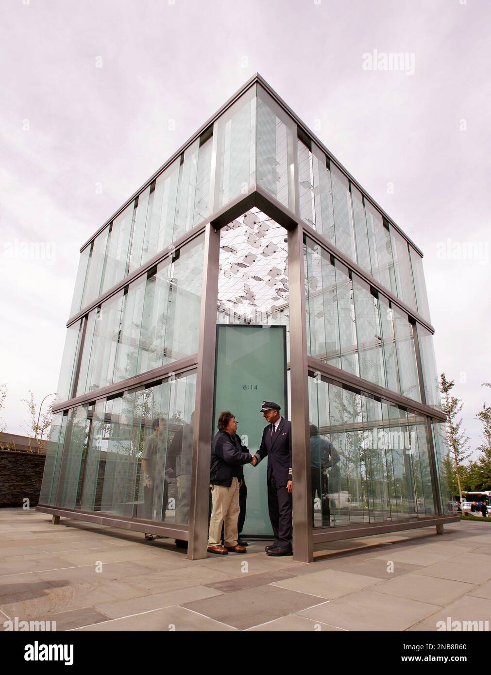 An American Airlines captain shakes the hand of a visitor at the 9/11 ...