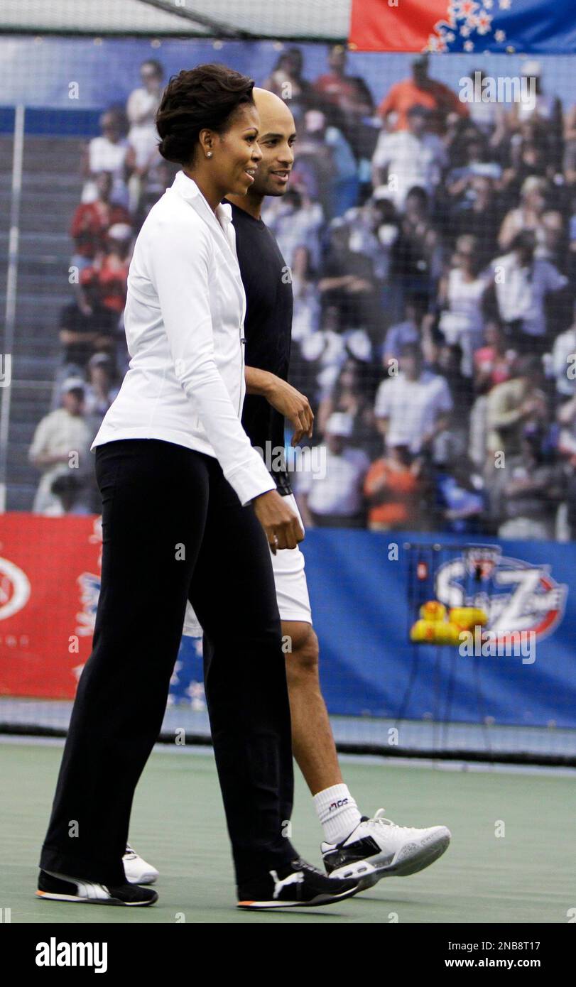 First lady Michelle Obama walks with James Blake at a U.S. Open tennis ...
