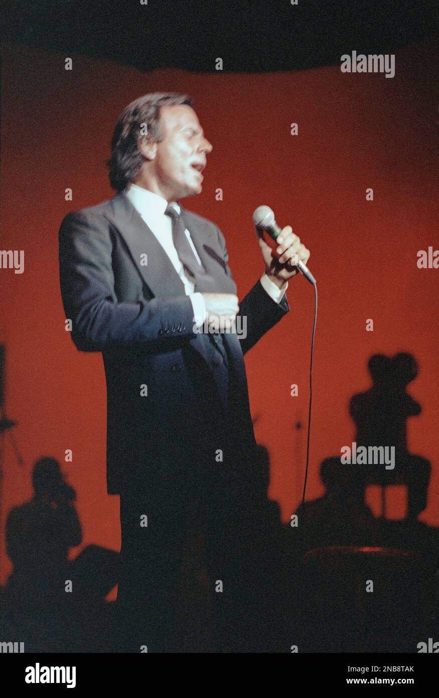 Julio Iglesias sings during his performance on stage at Radio City ...