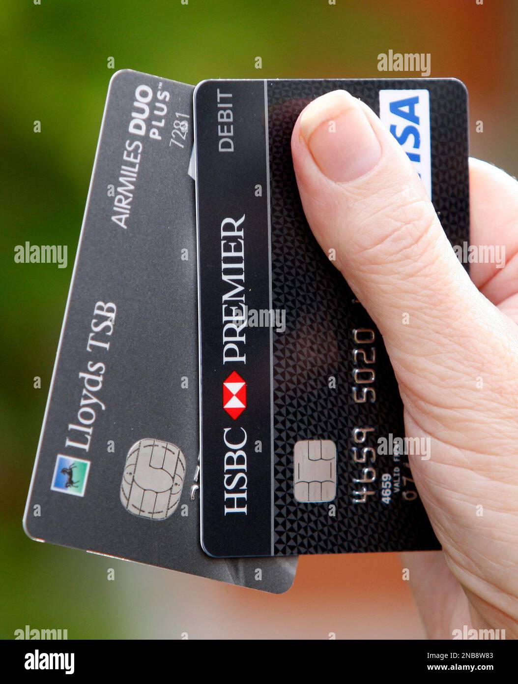 Two bank smart cards are displayed in London, Friday, Sept. 9, 2011 ...