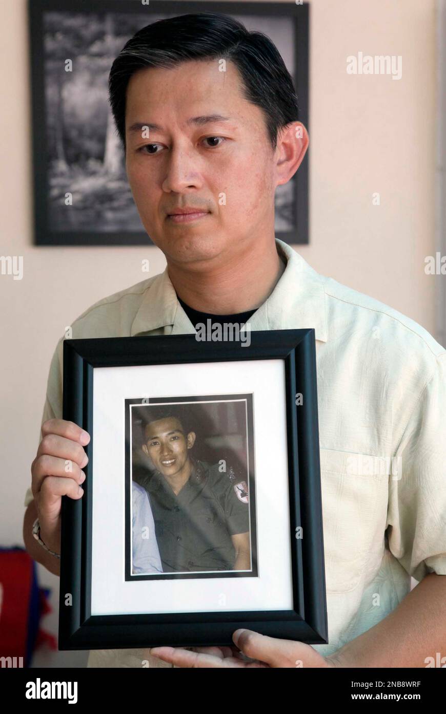 In this photo taken Friday, July 29, 2011, Daniel Luong holds a photo ...