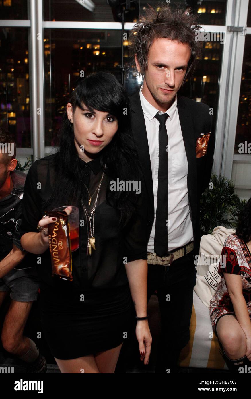 Ellie Innocenti and Kris Kovacs, members of the band Deluka, pose with ...