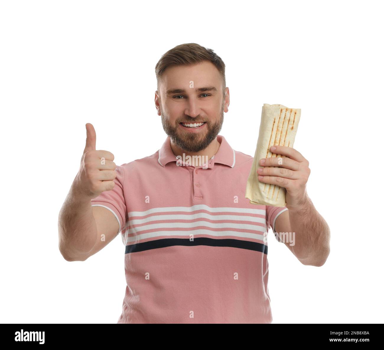 Young man with delicious shawarma on white background Stock Photo - Alamy