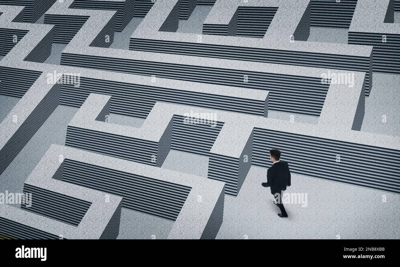 Thoughtful businessman trying to find way out of maze Stock Photo - Alamy