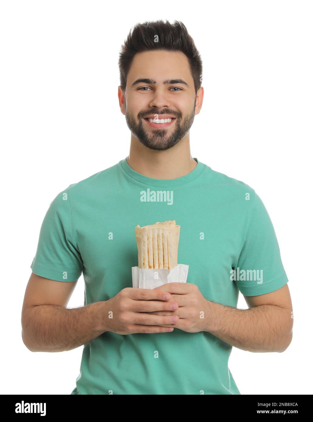 Happy young man holding tasty shawarma isolated on white Stock Photo ...