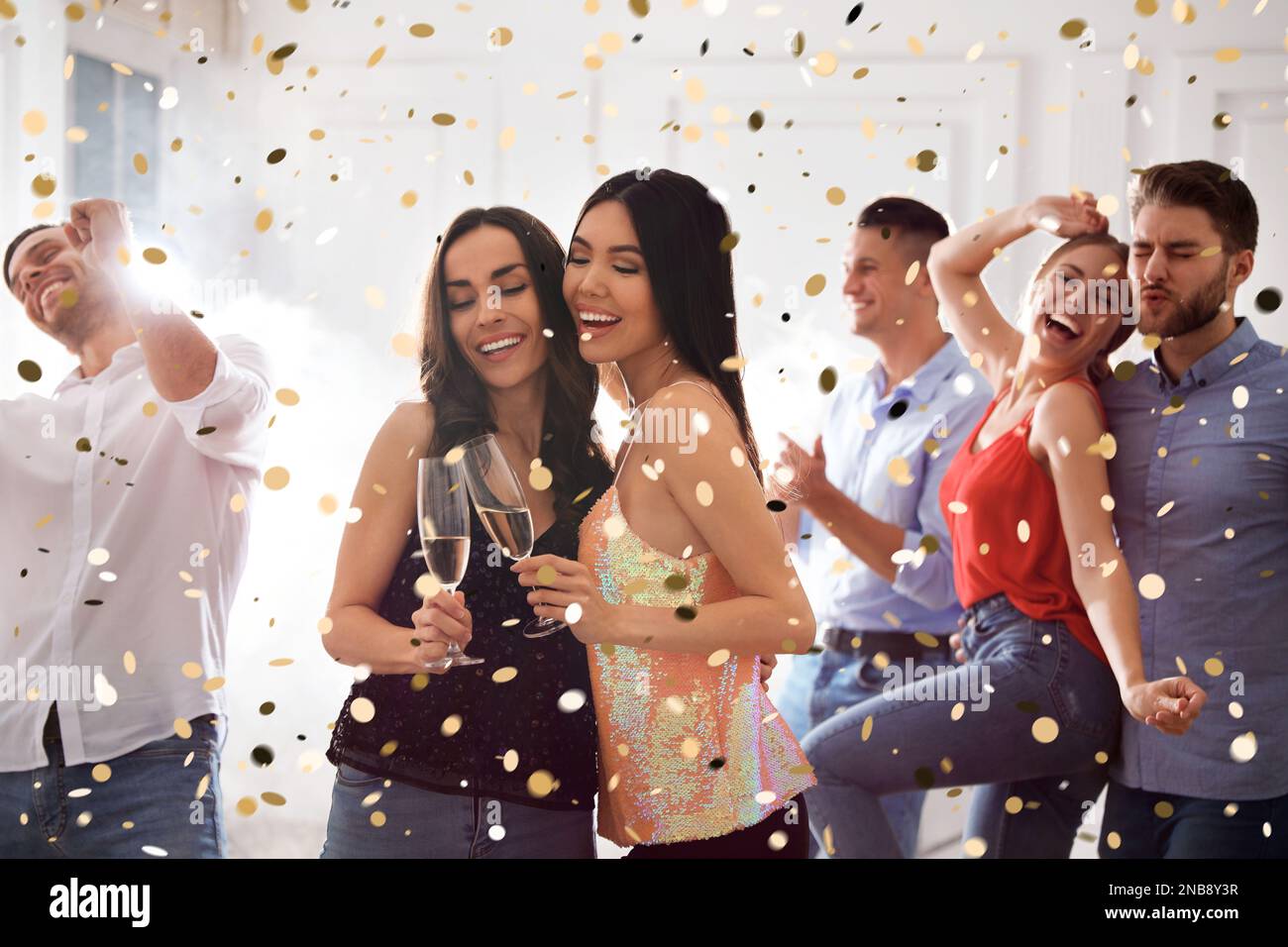 Group of happy friends dancing at party Stock Photo - Alamy